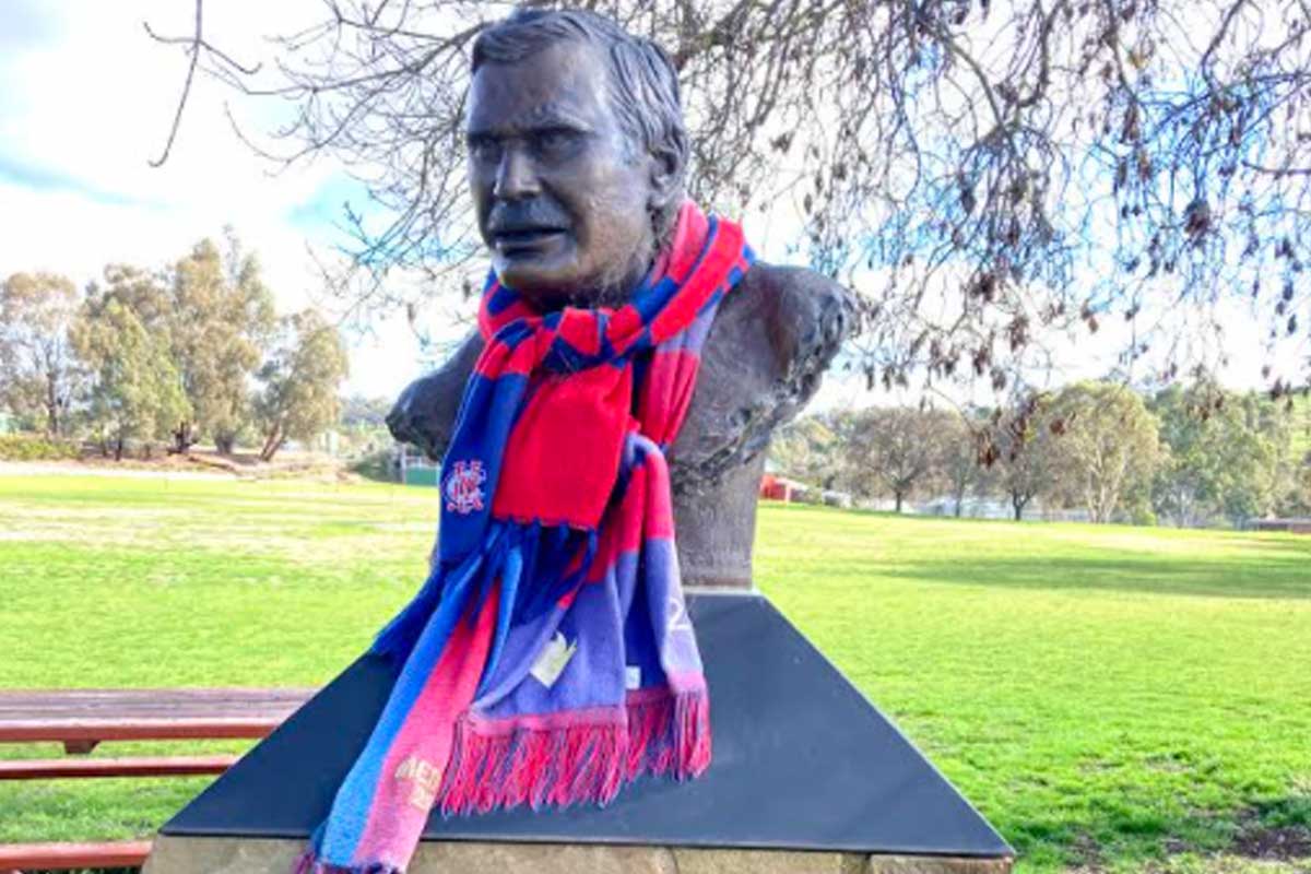 Ron Barassi statue decked out in Demons gear!