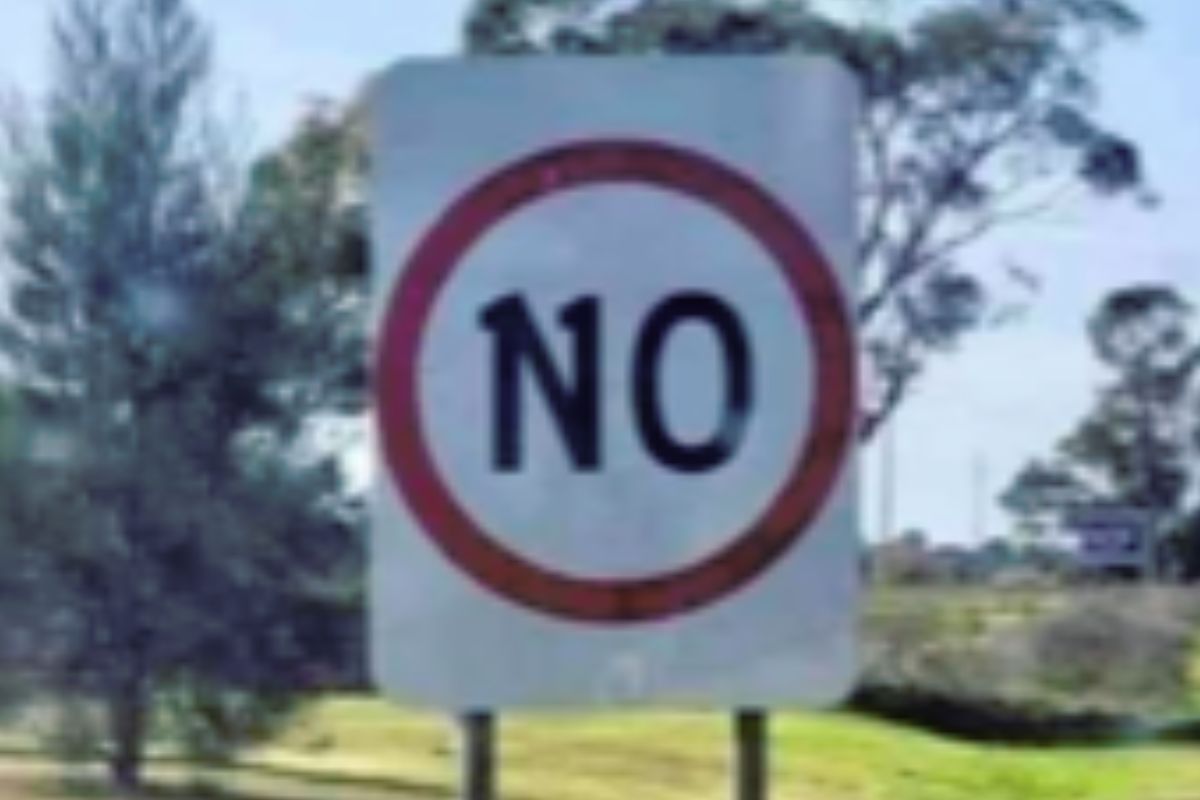 Speed sign on Melbourne highway altered with tape to say the word 'NO'
