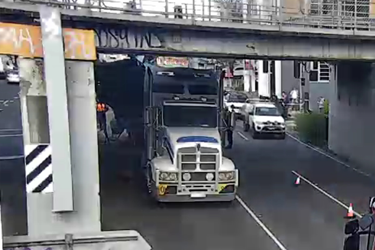 Truck stuck under bridge in Chadstone