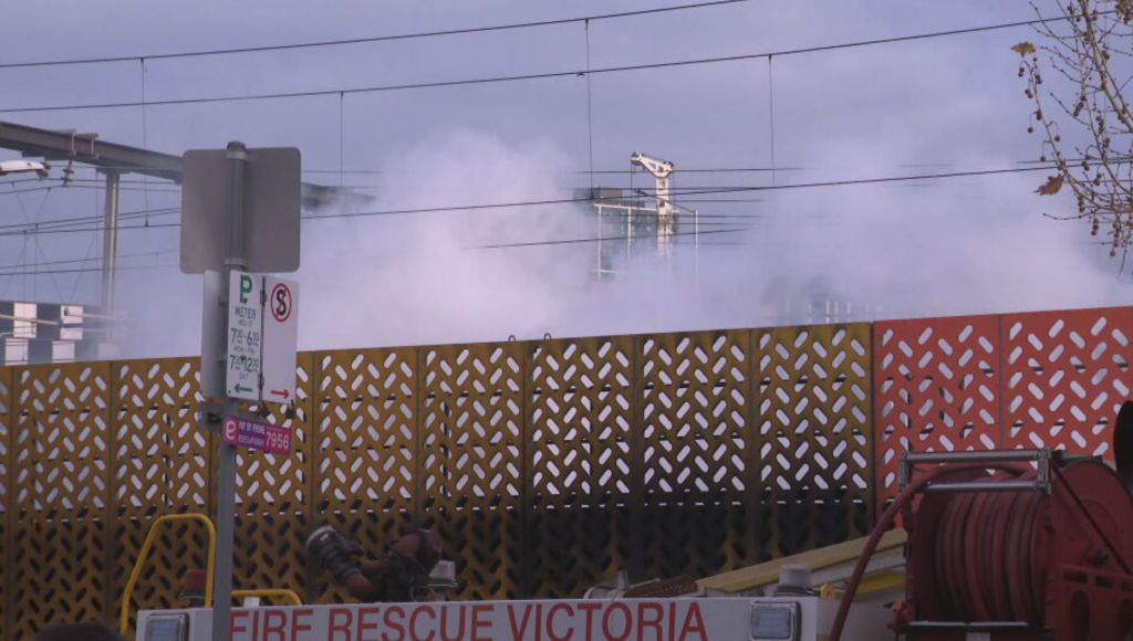 Train chaos as fire billows from underneath rail bridge